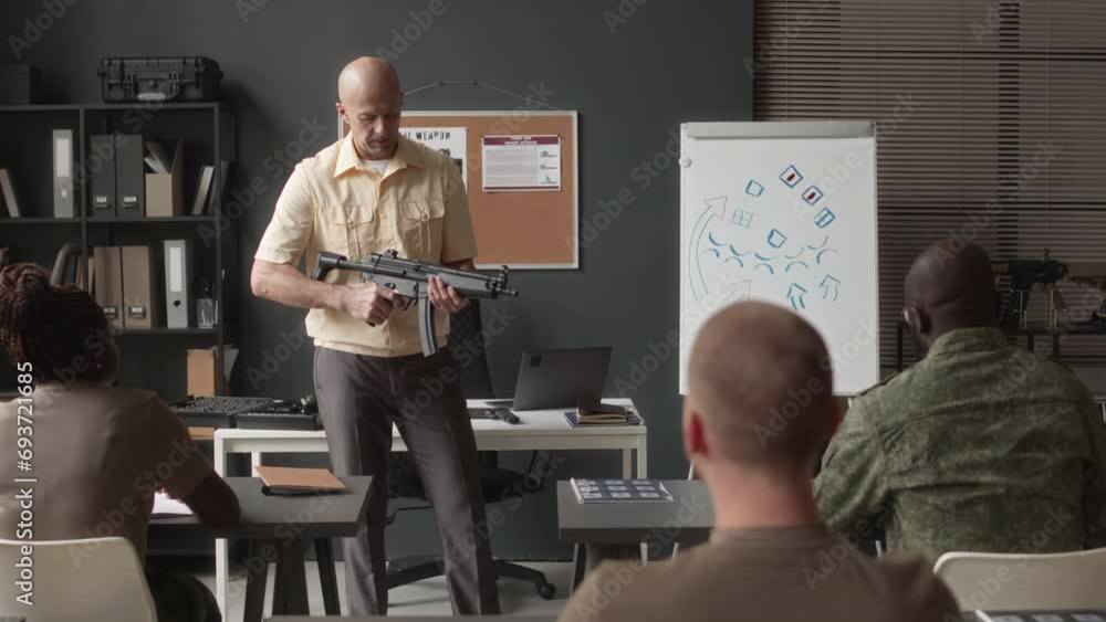 Back view of unrecognizable male cadet answering during class on ...