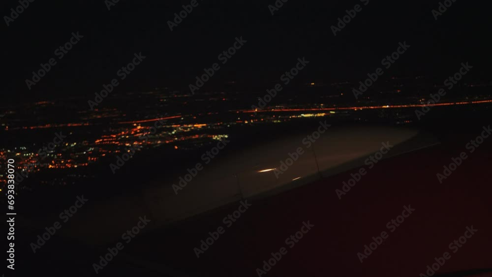 Airplane take off over night sky city lights, view from window sit ...