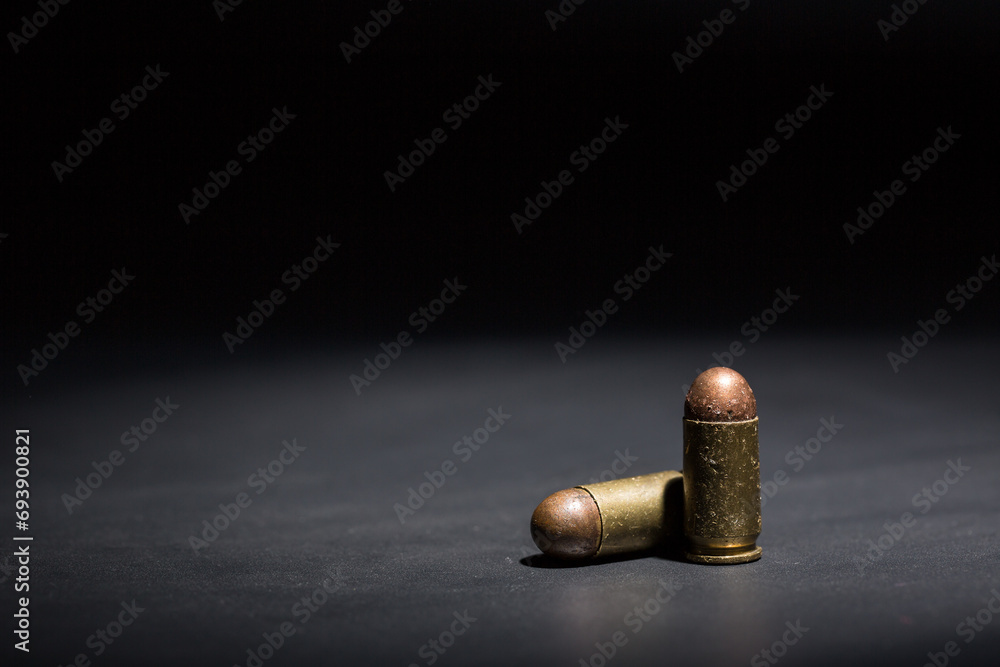 Firearm bullets on a black background, 9mm pistol cartridge Stock Photo ...