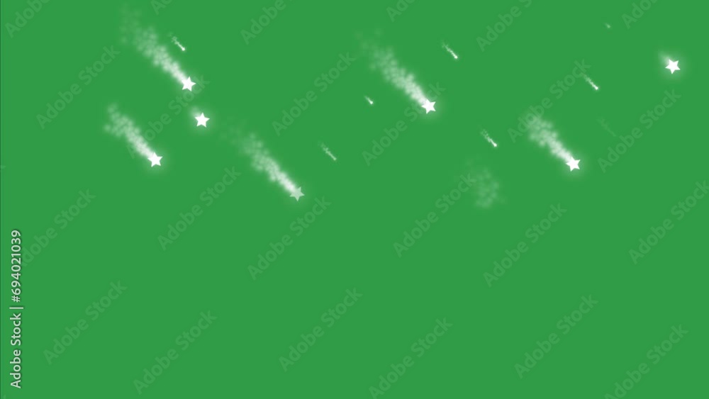 Blinking and glowing shooting stars rain down on a green screen ...