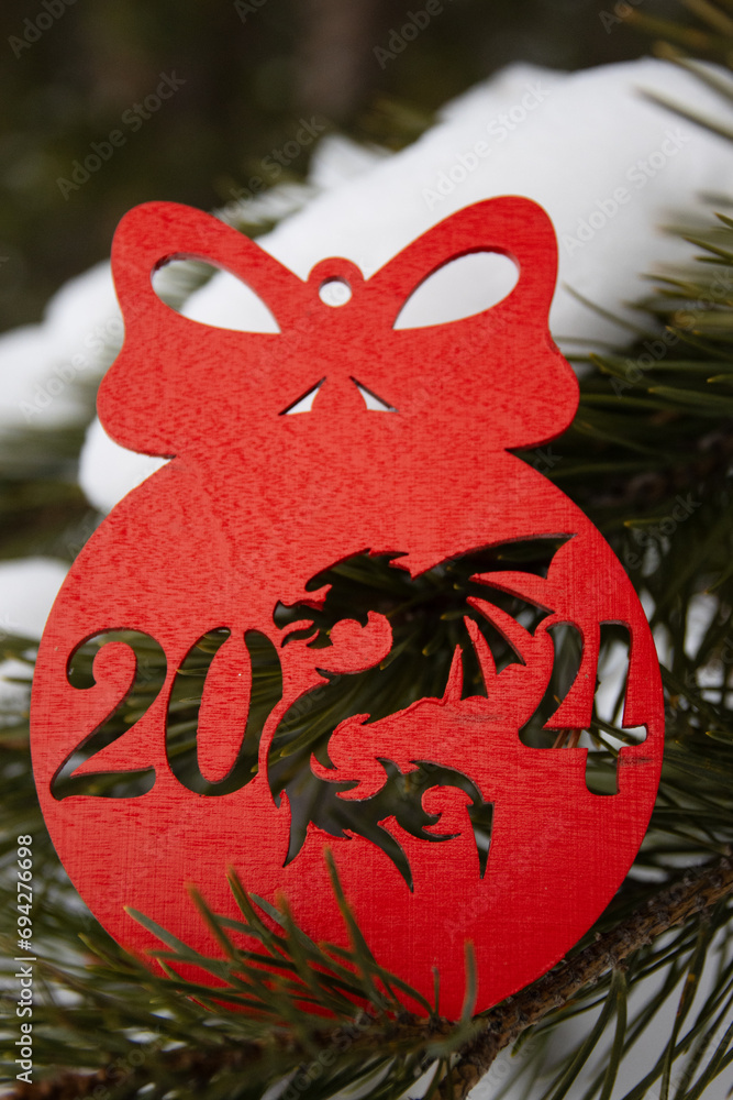 Christmas red ball 2024 with the image of a dragon on a branch ...