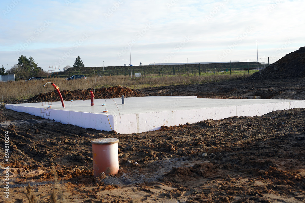 Cast foundation slab for a family house. We also see the prepared water ...