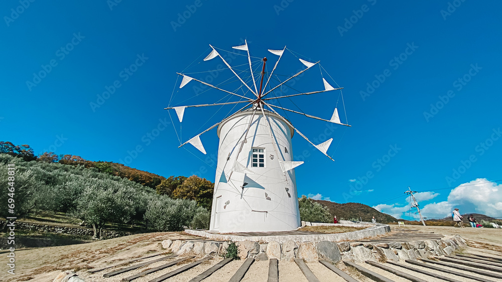 Greek windmill Roadside station Greek windmill at the olive grove on ...
