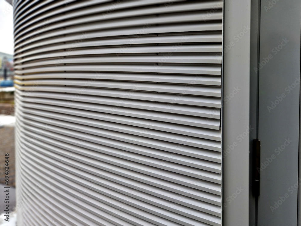 building is lined with square panels. metal sheet wall cladding with ...