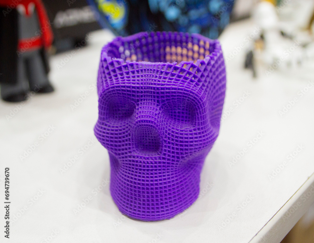 Prototype of human skull printed on 3D printer from molten purple ...