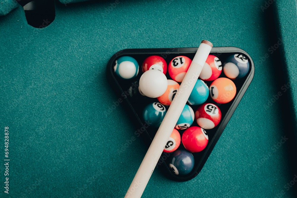 Multi colored billiard balls in the form of a triangle with numbers,a ...