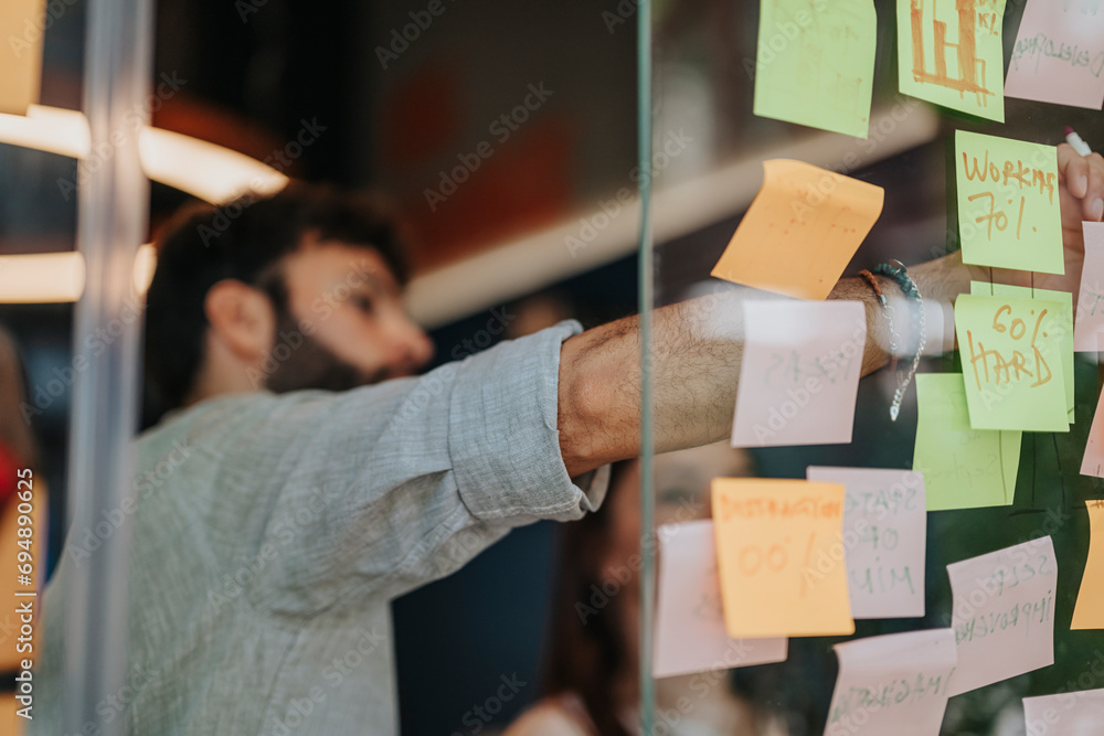 A diverse group of businesspeople brainstorming ideas and sharing ...