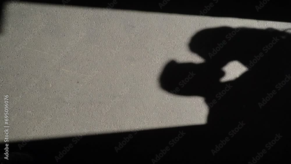 Shadow on the ground of couple in love looking to each other and ...