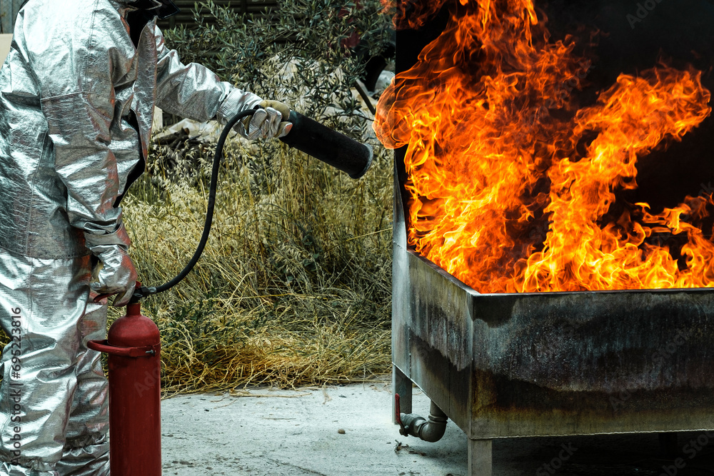 stcw firefighting prevention training, man using fire extinguisher ...