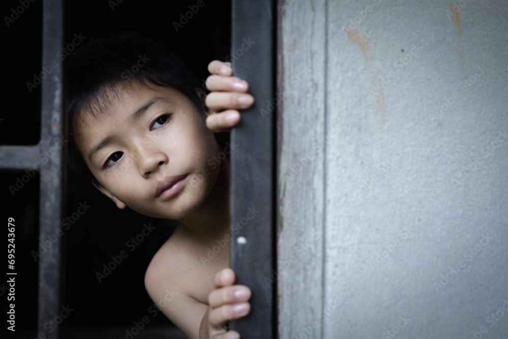 The child captured the iron cage with sadness and despair. The concept ...