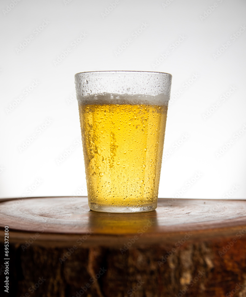 Glass of light beer on typical brazilian cup (americano long drink ...