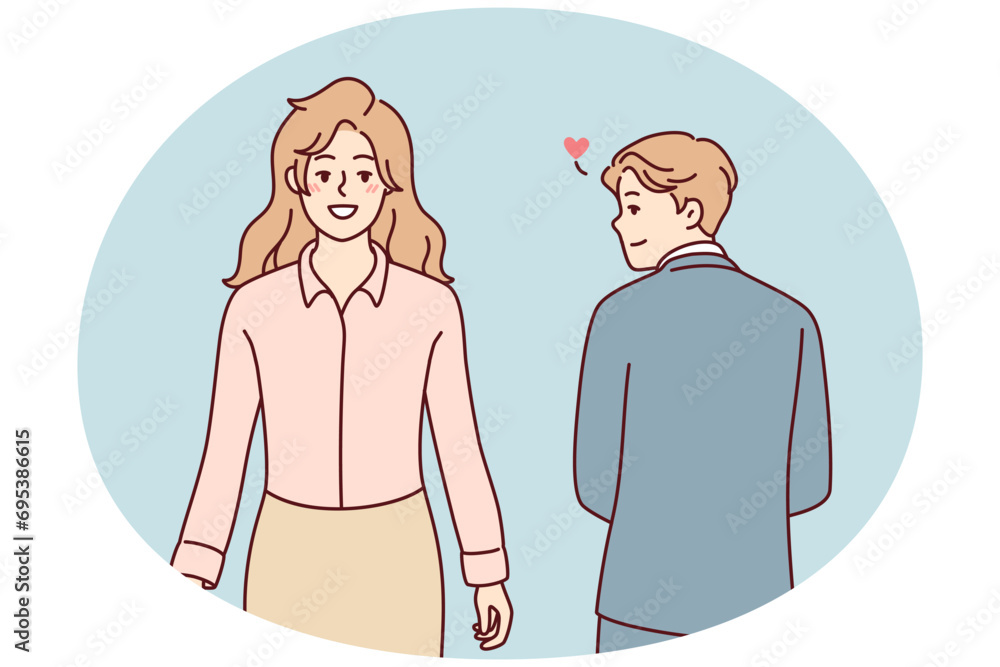 Man in business clothes looks back at beautiful woman having loving ...