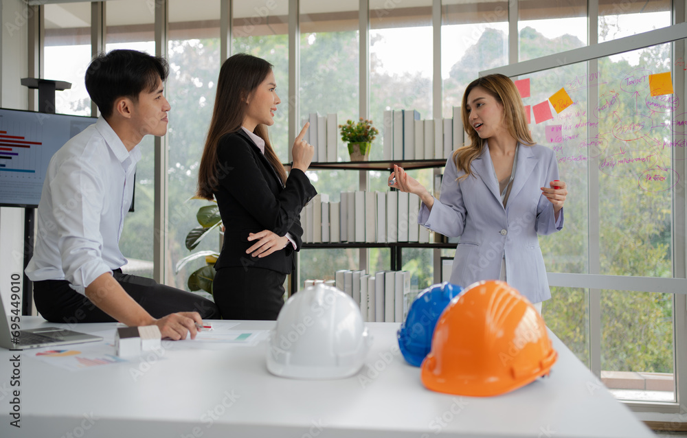Group of Asian businesspeople and engineers working and brainstorming ...
