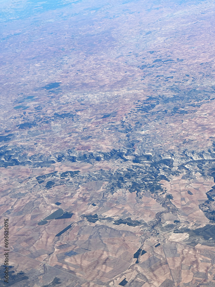 Airplane view. Aerial landscape. Small towns, roads and fields. Scenic ...