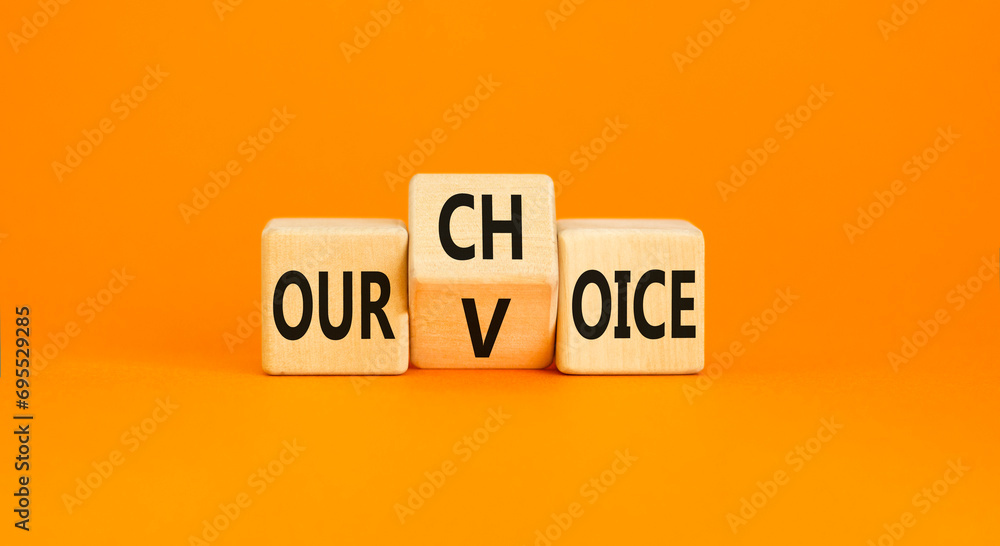 Our voice choice symbol. Businessman turns wooden cube and changes ...