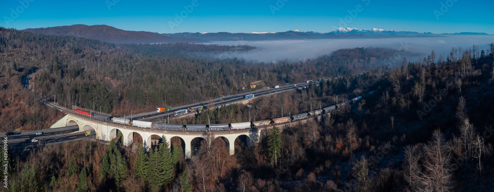 Modern logistics - single train running over the massive viaduct over ...