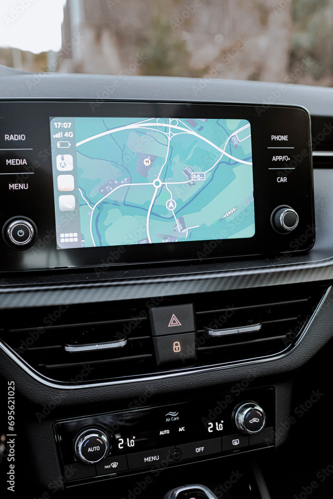 Map screen on a navigation device central console lcd in a tourism car ...