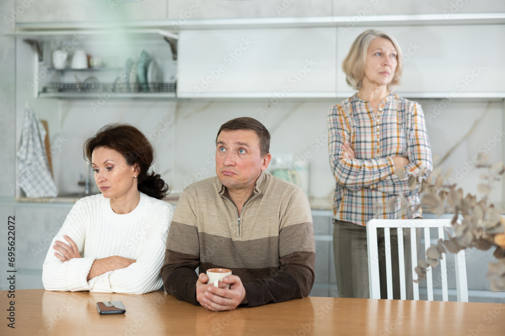 Family quarrel, all family members are upset, disappointed, keeping ...