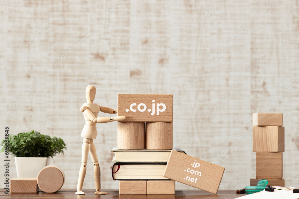 There is wood cube with the word .co.jp or. It is as an eye-catching ...