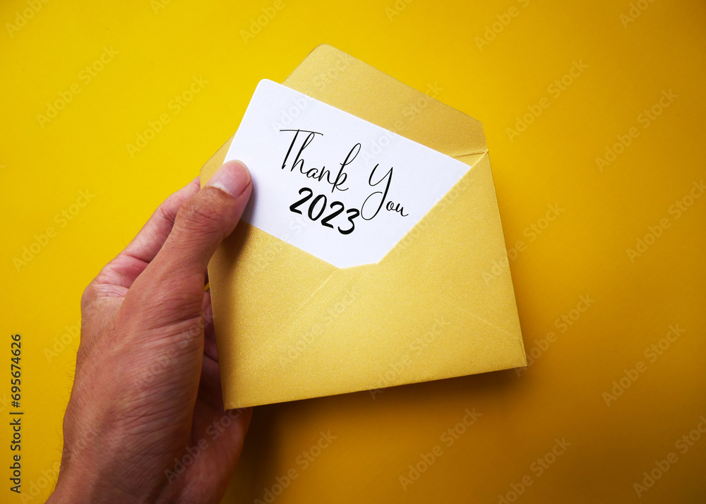 Thank you 2023. A piece of paper in an envelope with the words BYE BYE ...