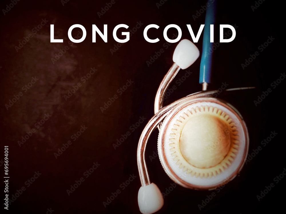 Long covid text in dark background. With stethoscope and COVID-19 virus ...
