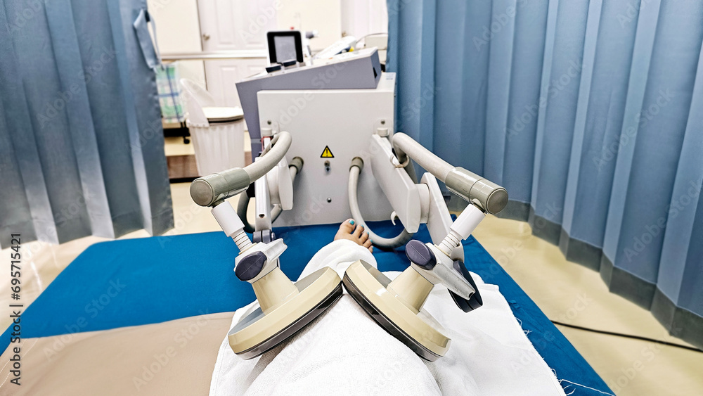 Leg heat therapy. Patient Receiving Electromagnetic Therapy ...