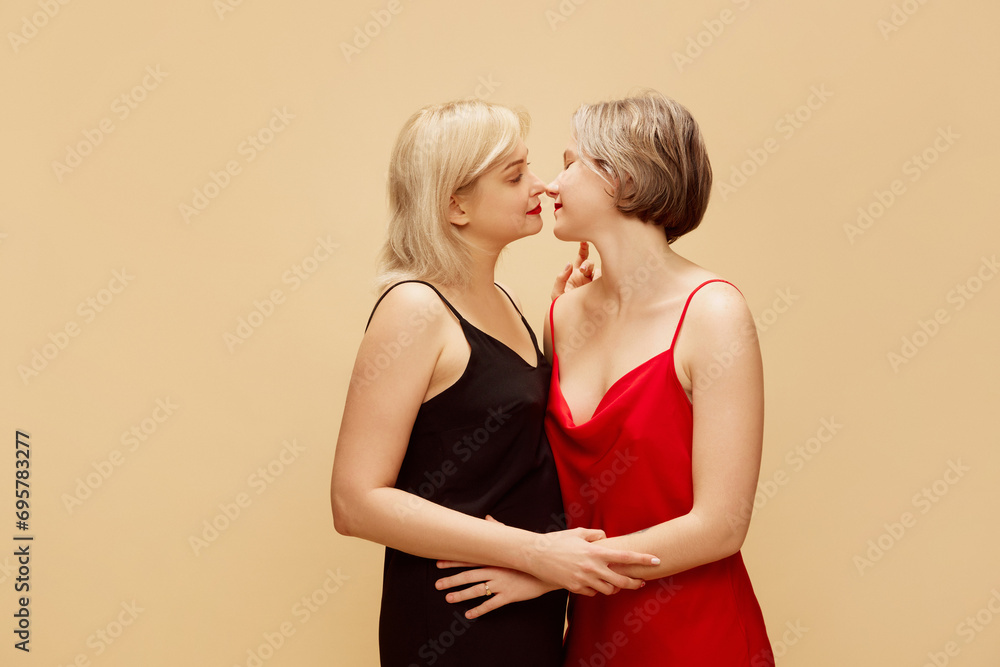 Tenderness Beautiful Young Women In Black And Red Dresses Lesbians