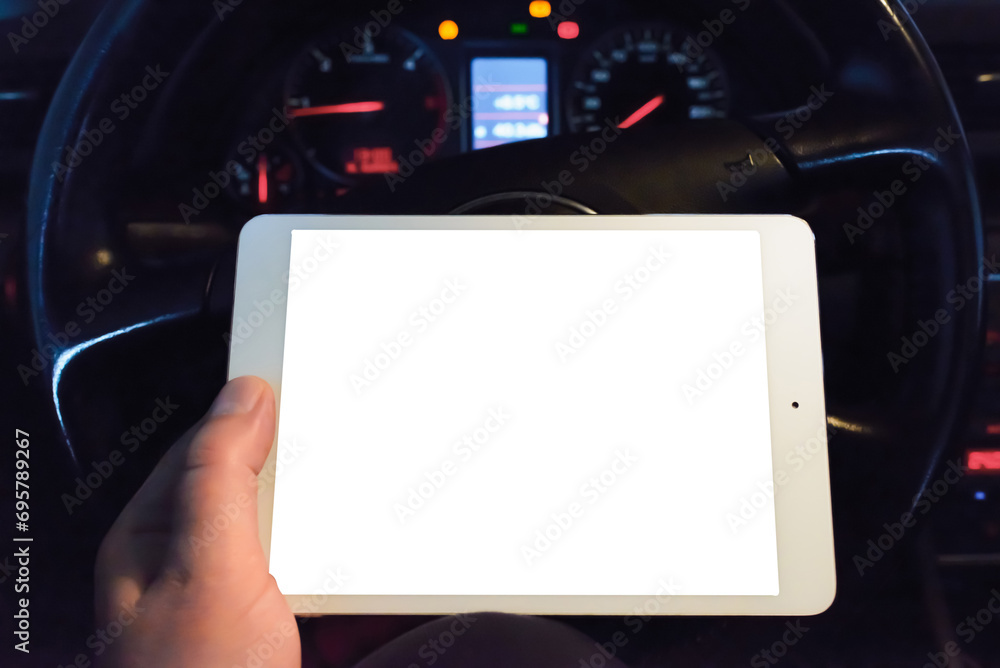 Mockup white screen.A mechanic looking at pc digital tablet in a car ...
