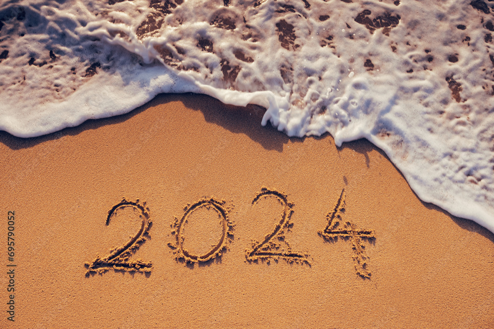Happy New Year 2024 concept, lettering on the beach. Written text on ...