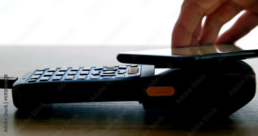 Payment made with smartphone using nfc system mobile phone on cash ...