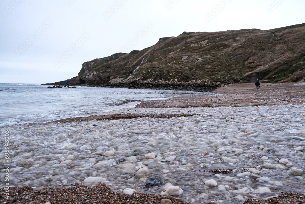Lulworth Cove and beach view at winter day. Lulworth Cove bay, beach ...