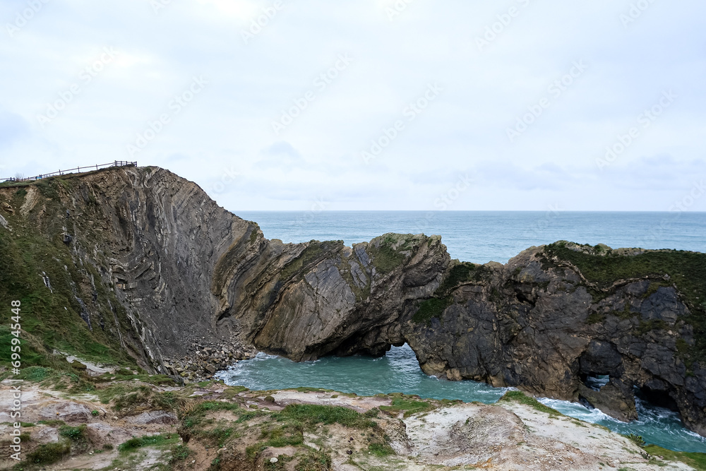 Lulworth Cove cliffs view on a way to Durdle Door. The Jurassic Coast ...