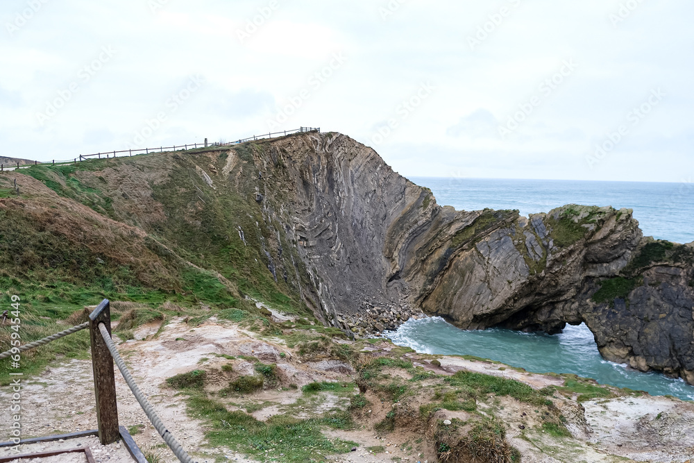 Lulworth Cove cliffs view on a way to Durdle Door. The Jurassic Coast ...