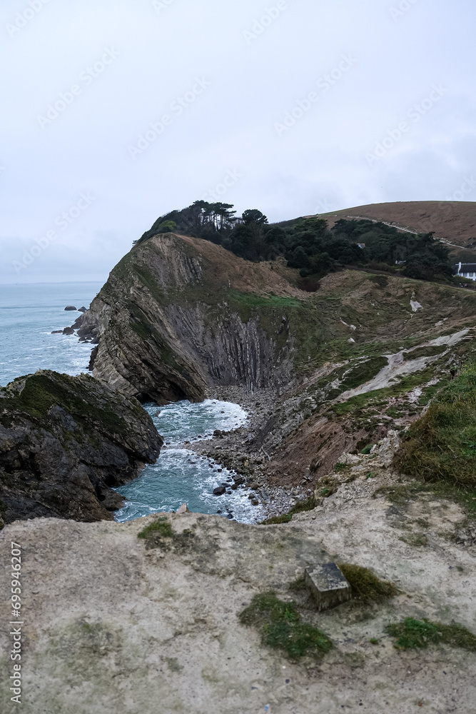 Lulworth Cove cliffs view on a way to Durdle Door. The Jurassic Coast ...
