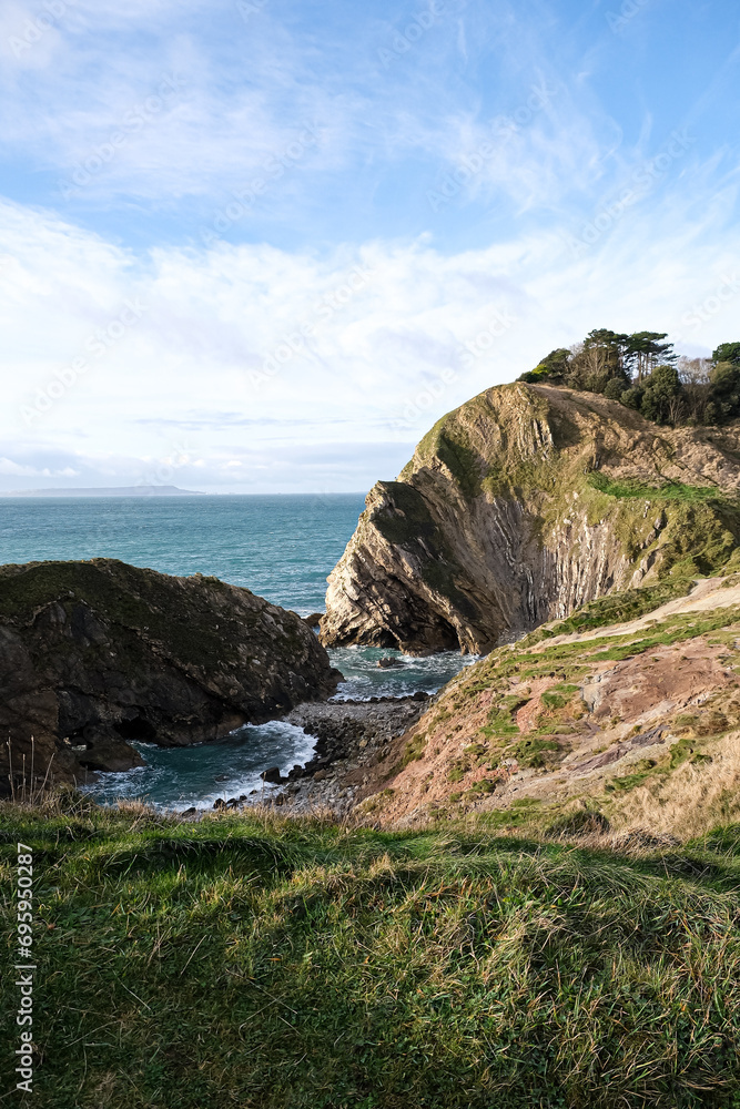 Lulworth Cove cliffs view on a way to Durdle Door. The Jurassic Coast ...
