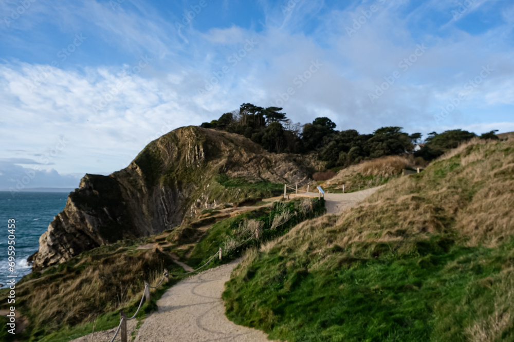 Lulworth Cove cliffs view on a way to Durdle Door. The Jurassic Coast ...