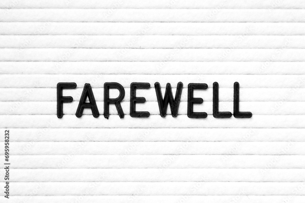 Black color letter in word farewell on white felt board background ...