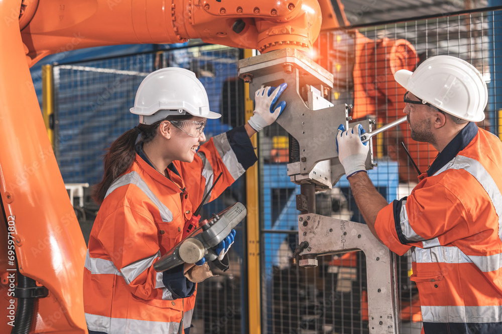 Mechanical engineering male and female engineers wear uniforms to ...