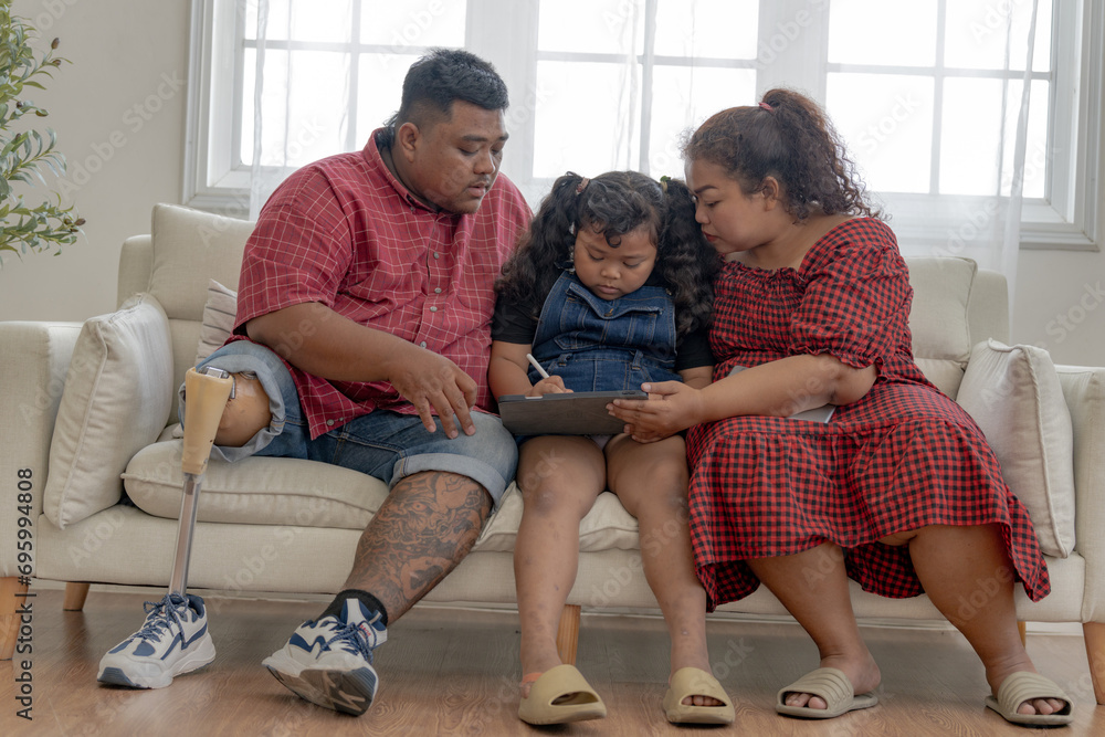 Happy Asian family using tablet. Asian Chubby father mother and kid ...