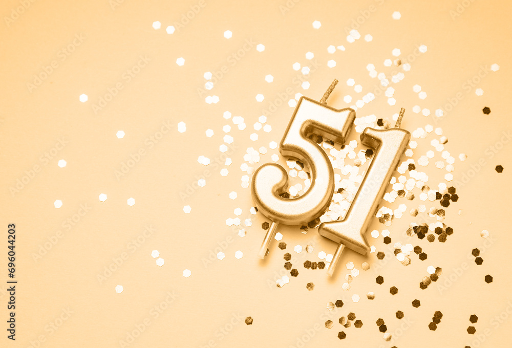 51 years celebration festive background made with golden candle in the ...