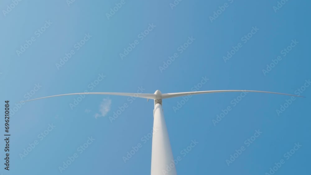 Atop a mountain windmill farm turbines illustrate efficient clean ...