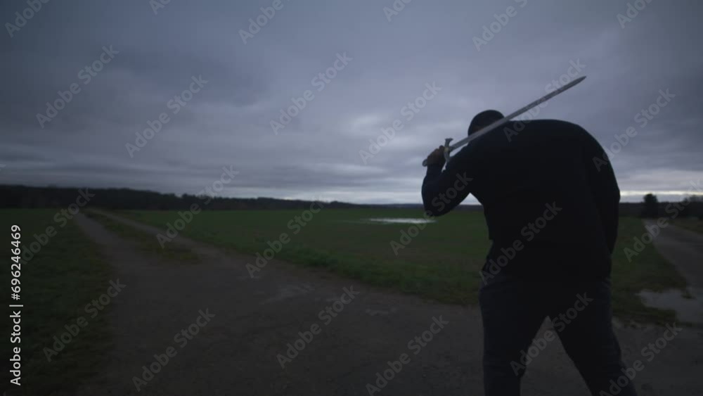 Modern Black Swordsman Warrior Awaiting Battle Opponent in Open Field ...