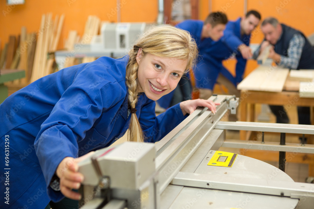 female carpentry apprentice smiling and posing Stock Photo | Adobe Stock