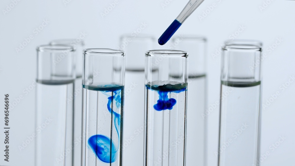 Close up laboratory glassware on white background. Test tubes with ...
