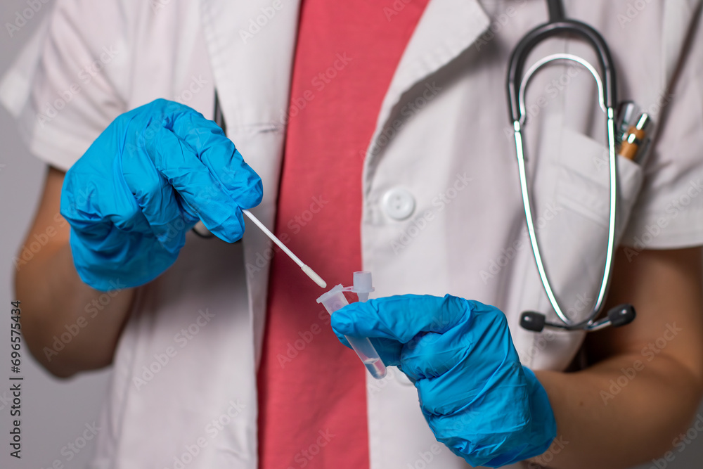 Doctor in a hospital using rapid antigen test kit for self test COVID ...