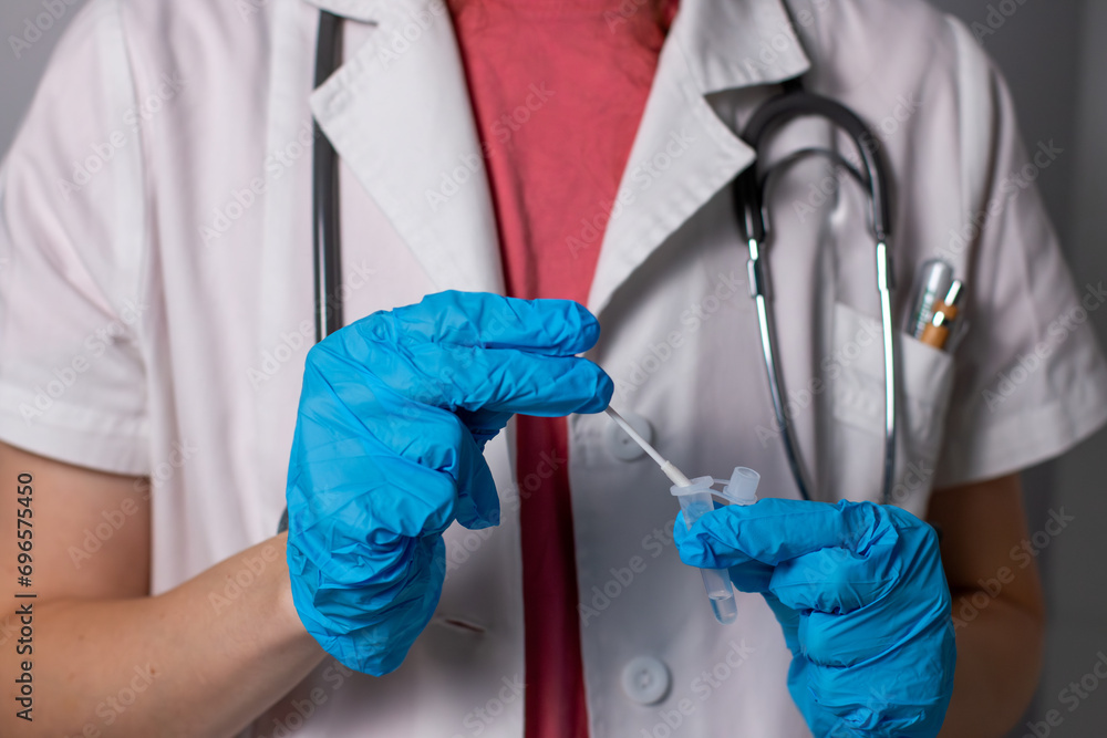 Doctor in a hospital using rapid antigen test kit for self test COVID ...
