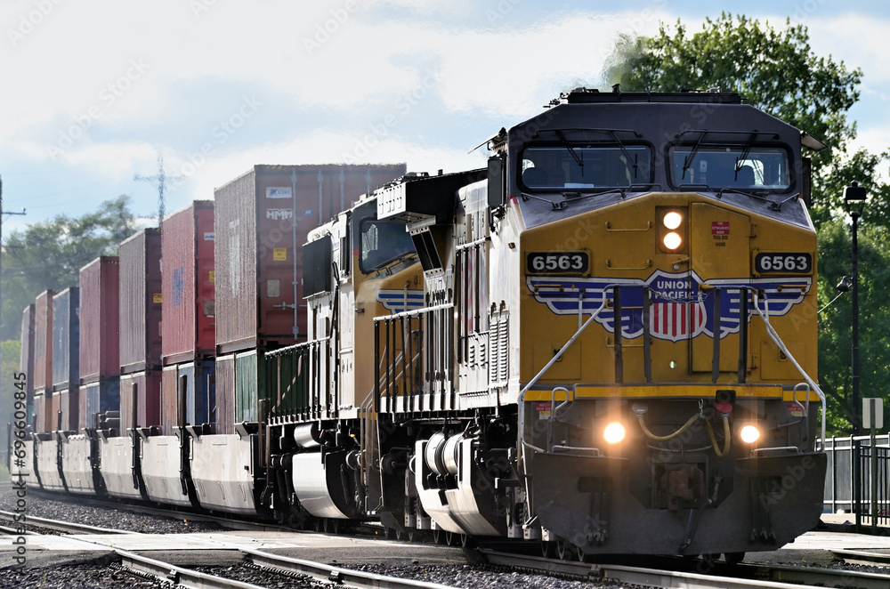 Two locomotives lead a Union Pacific Railroad intermodal freight train ...
