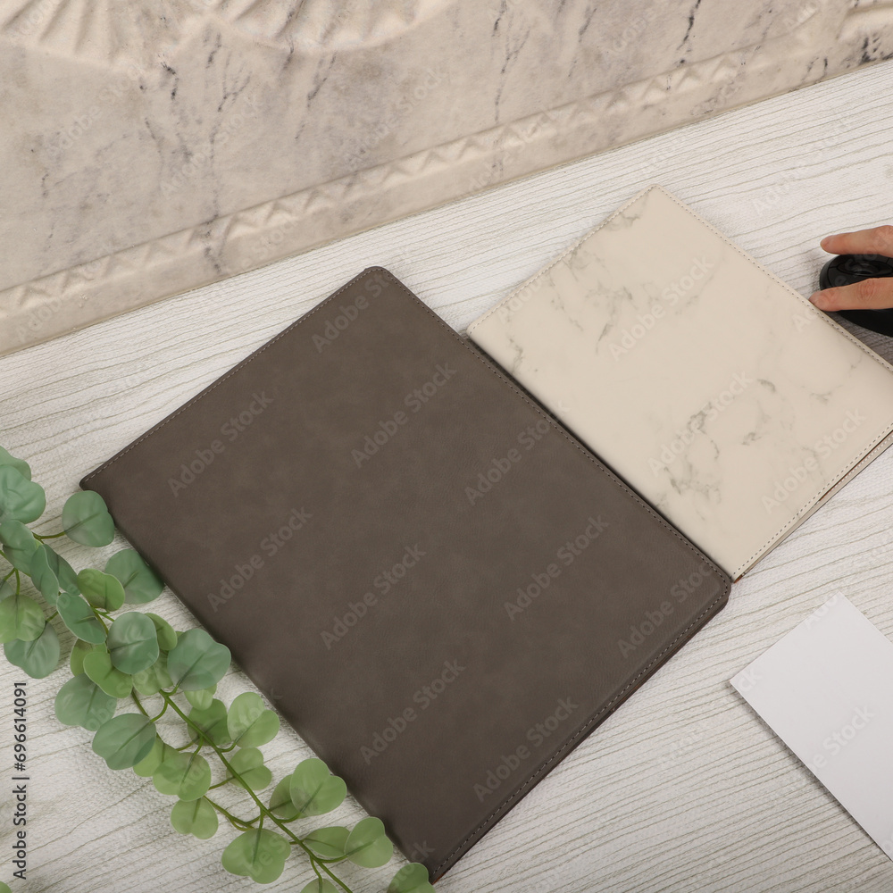 Leather portfolio. Concept shot, top view, portfolio in gray colors and ...