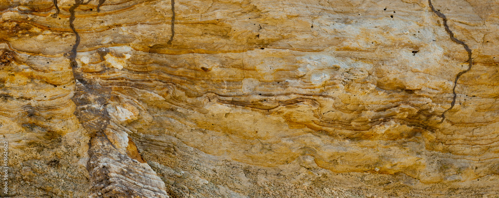 Sand quarry. Sedimentary rocks with a high content of iron oxide. Red ...