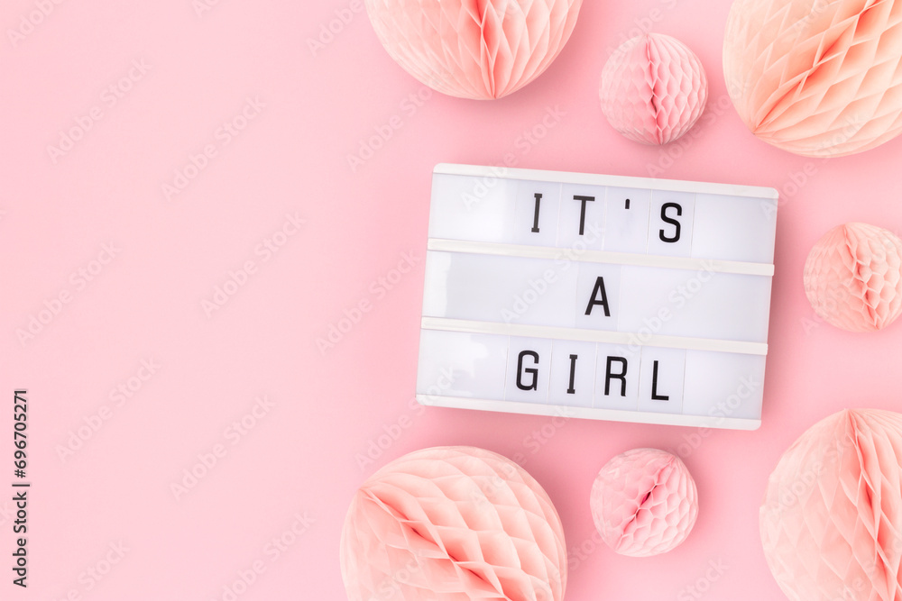 It's a girl. Lightbox with letters and tissue paper balls in a pink ...
